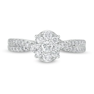 5/8 CT. T.W. Oval Multi-Diamond Crossover Shank Engagement Ring in 14K ...