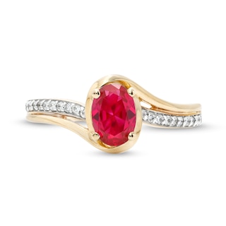 Oval Lab-Created Ruby and 1/10 CT. T.W. Diamond Bypass Ring in 10K Gold ...